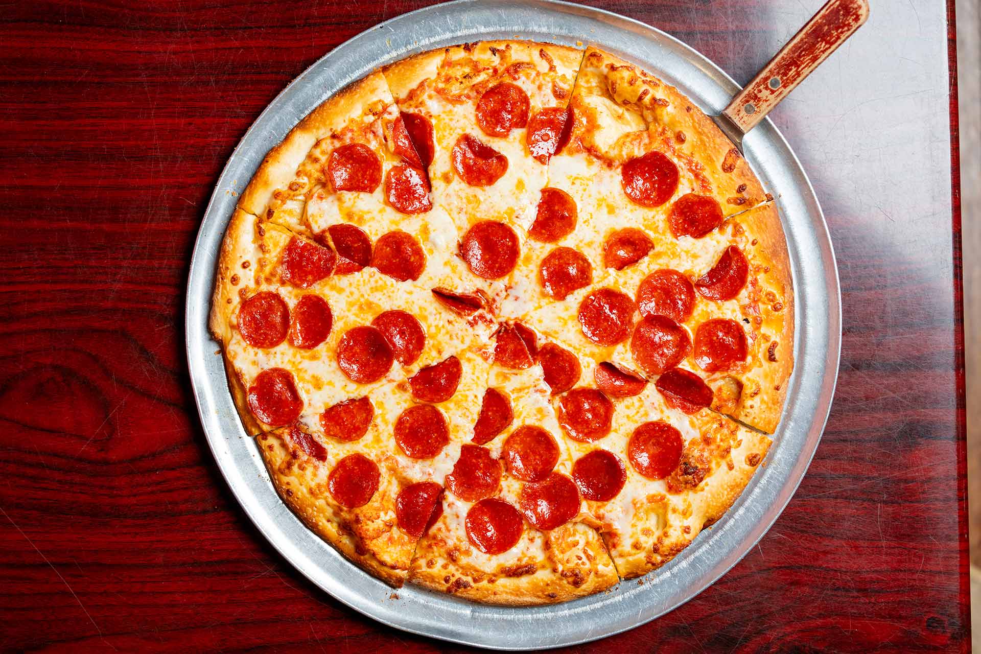 Paradise Pizza - About